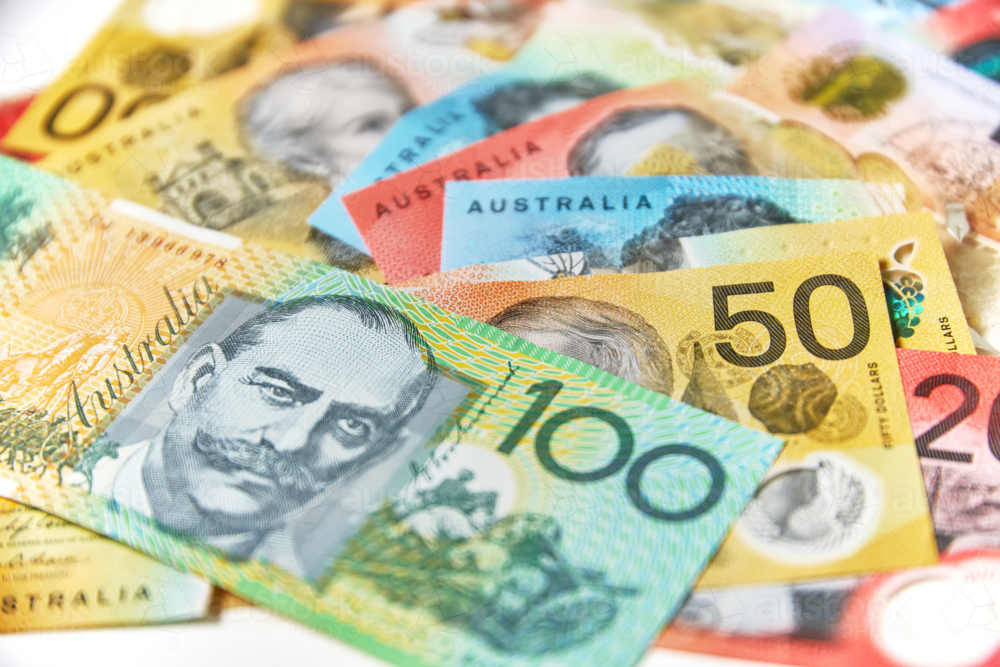 Image of Collection of Australian banknotes scattered on a flat surface ...
