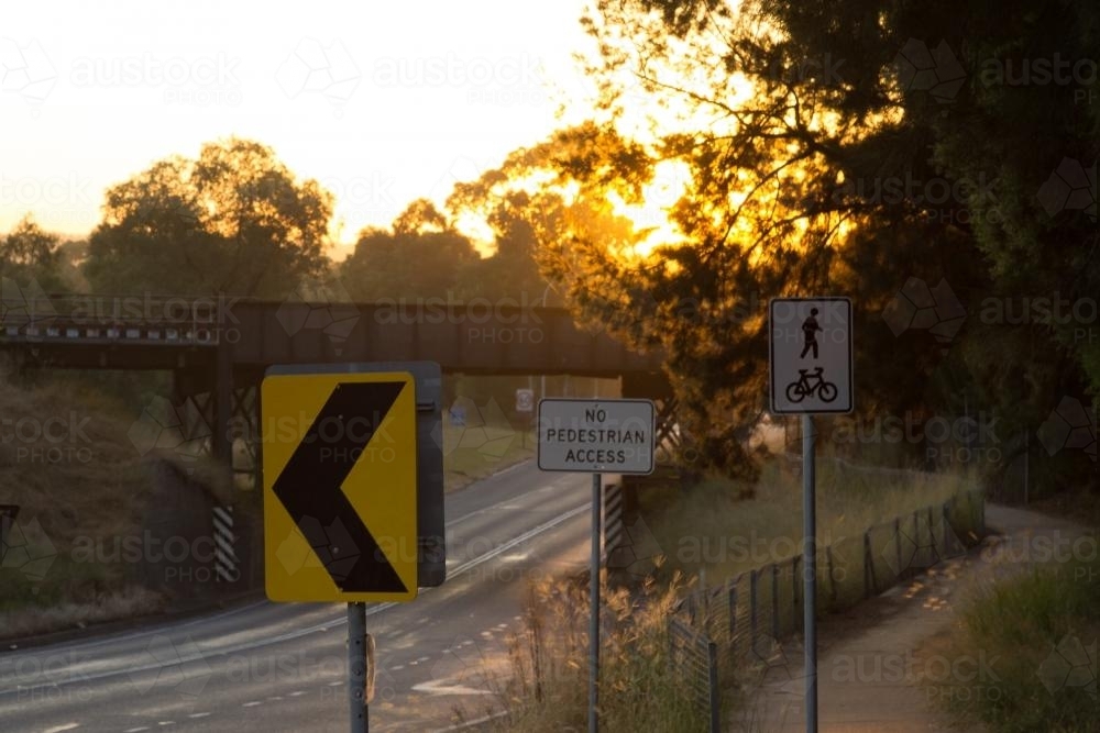 Image of Collection of road signs at sunrise - Austockphoto