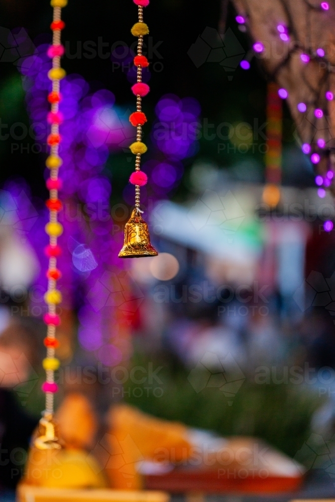 Image of Colourful garlands hanging from trees at multicultural ...