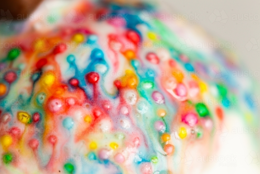 Image of Colourful hundreds and thousands sprinkles melting on ice ...