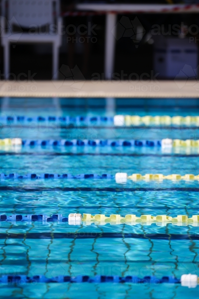 Image of Colourful lane ropes at a swimming pool - Austockphoto