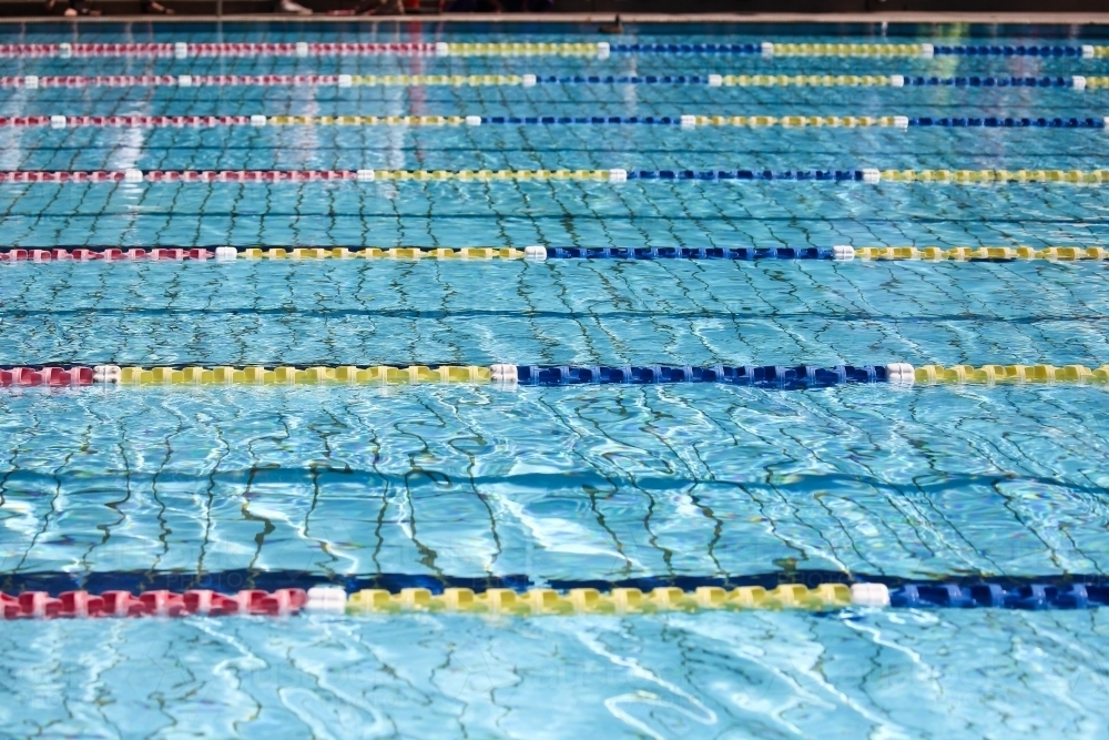 Image of colourful lane ropes in a swimming pool - Austockphoto