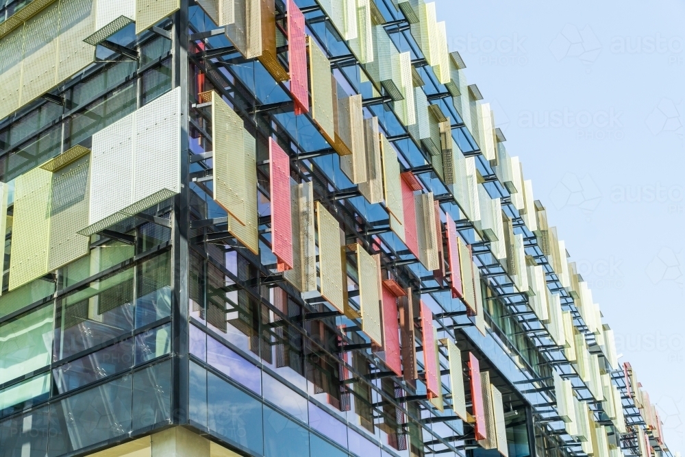 Image of Colourful panels lining the outside of a multi storey building ...