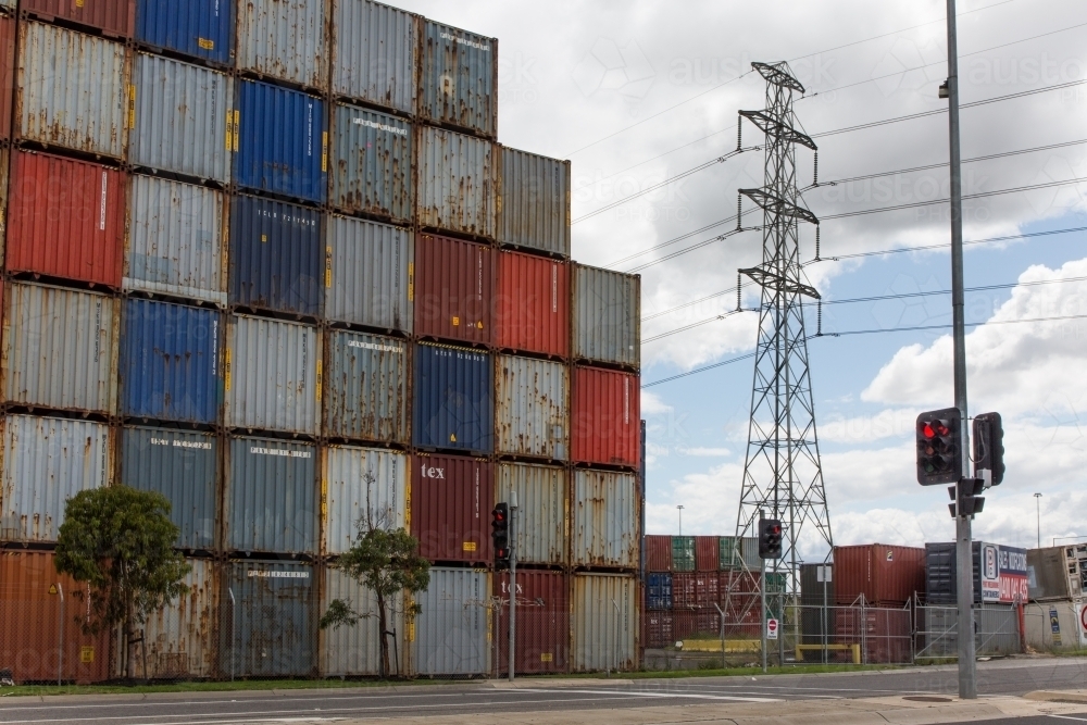 Image of Colourful shipping containers, traffic lights and a power pole ...