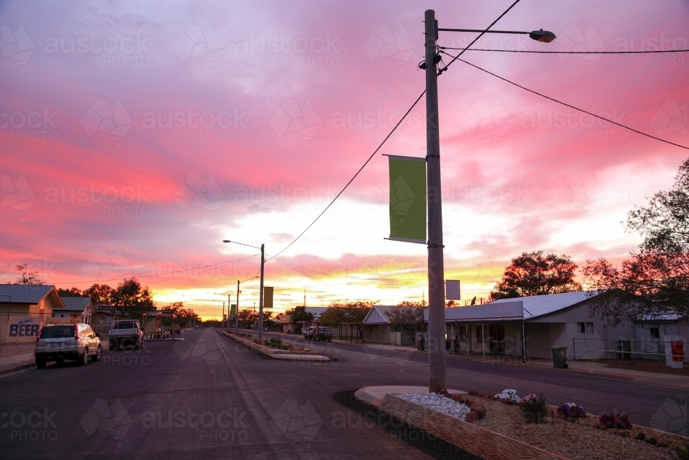 Image of Colourful sunrise over street in a country town. - Austockphoto