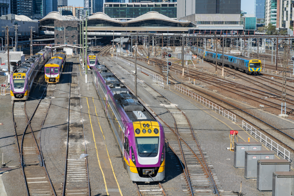 Image of Commuter trains at city railway station - Austockphoto