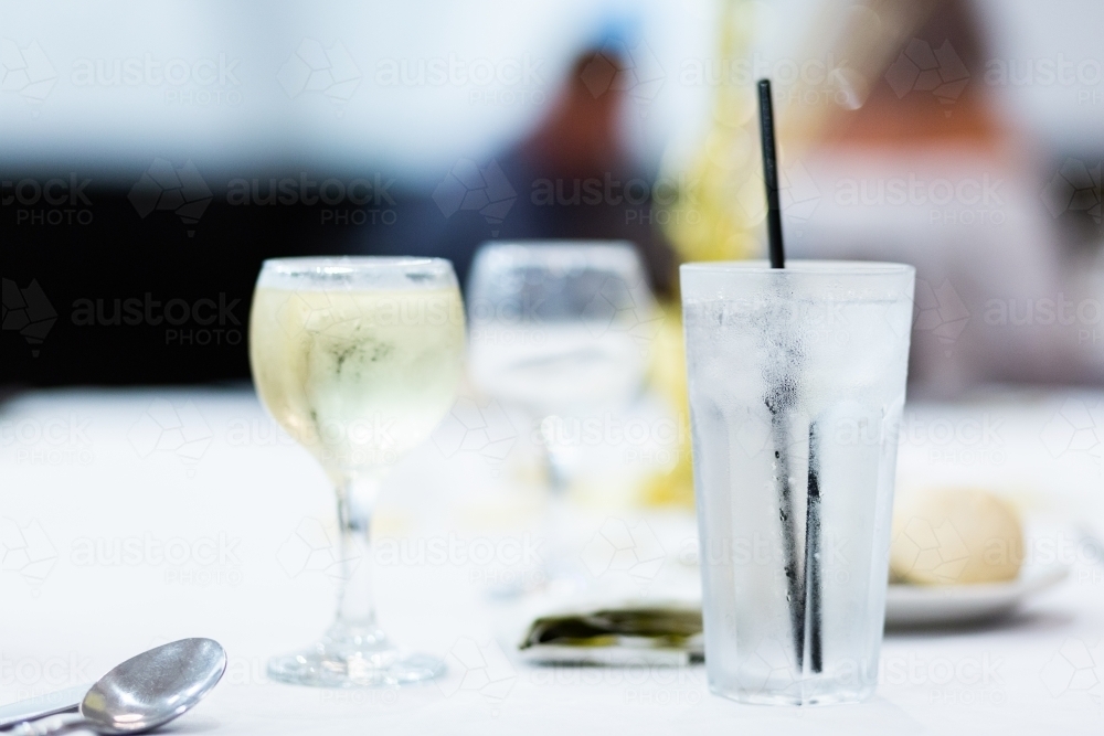 Image of Condensation on cold drink glass on table at event - Austockphoto