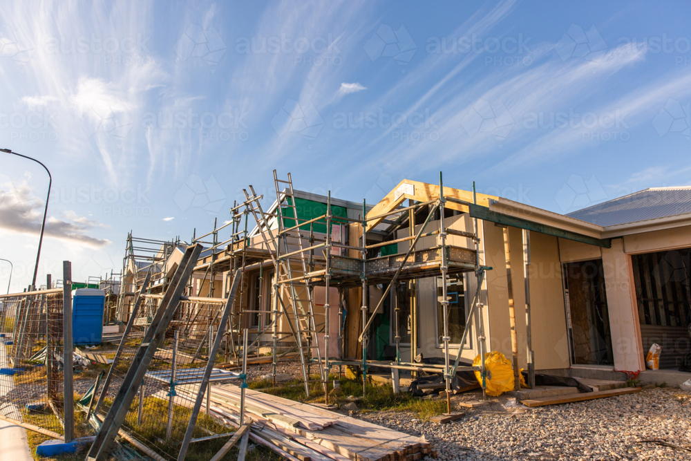 Image of construction site with a temporary fence and building ...