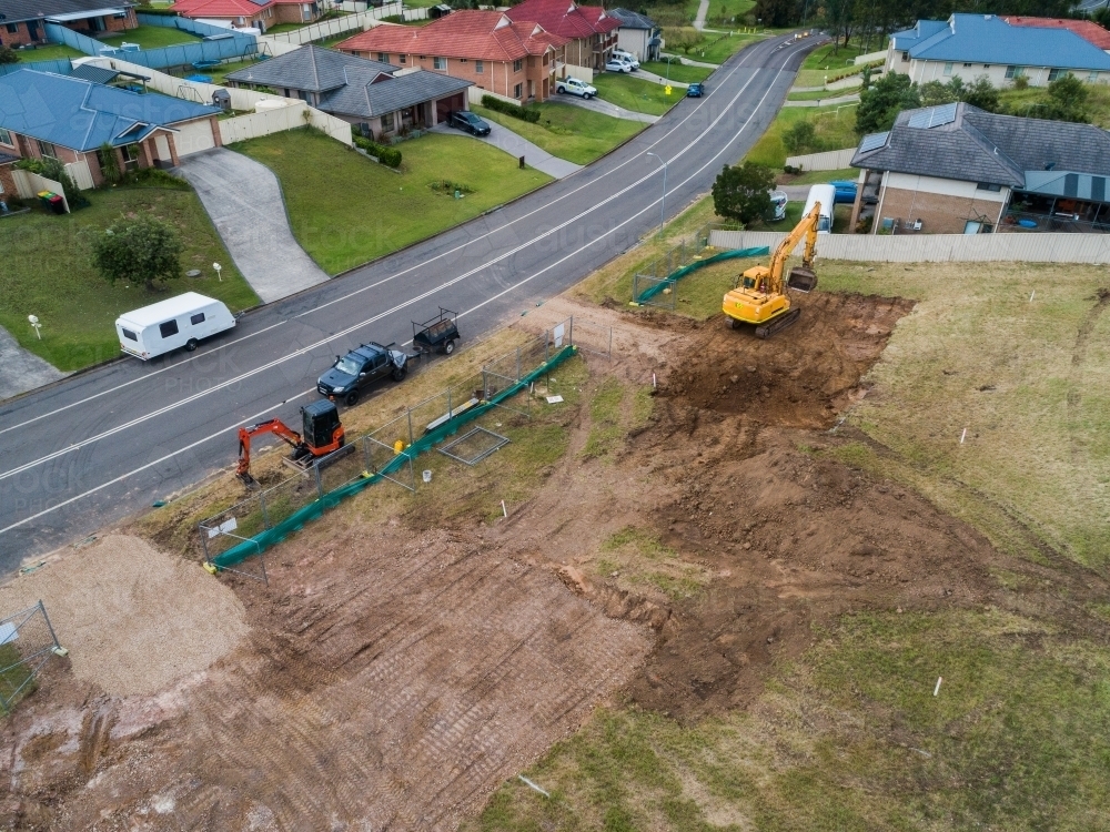 Image of Construction site with digger levelling out ground for house ...