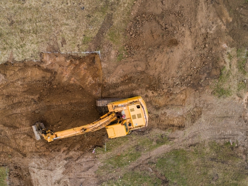 Image of Construction site with digger levelling out ground for house ...