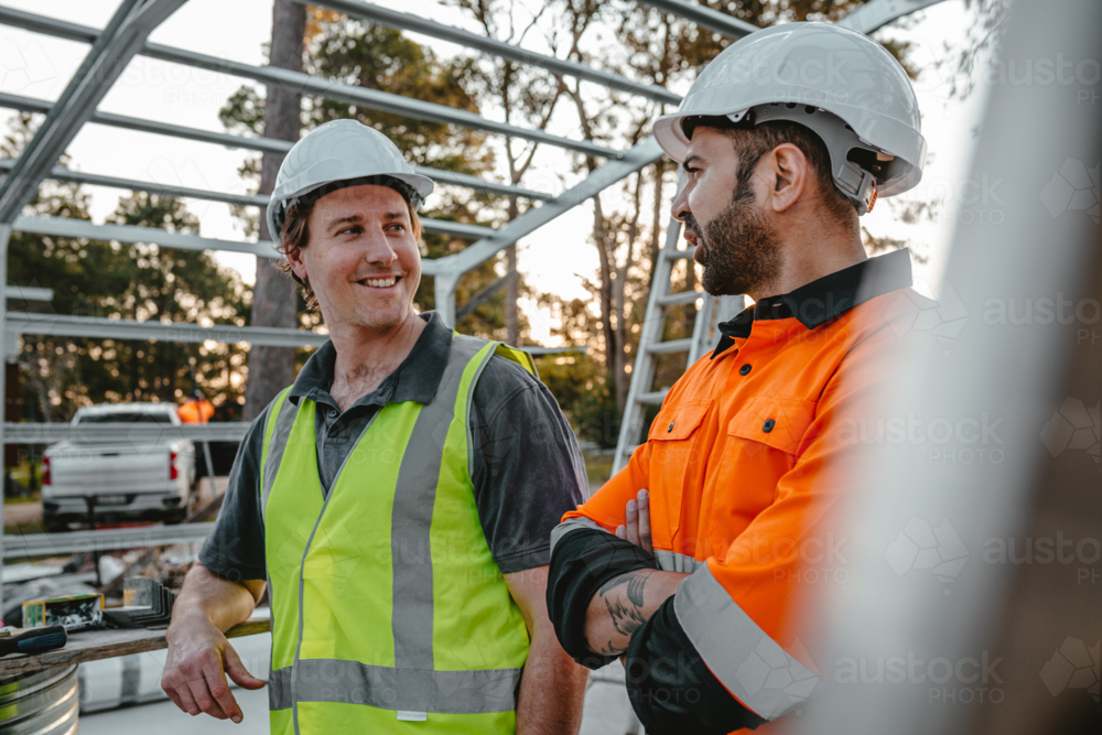 Image of Construction workers looking at each other at the construction ...