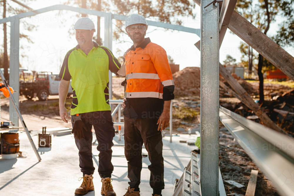 Image of Construction workers looking at the construction site ...