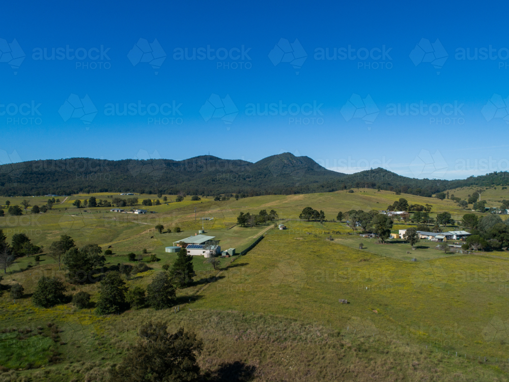 Image of country landscape with green grass hills and blue sky in ...