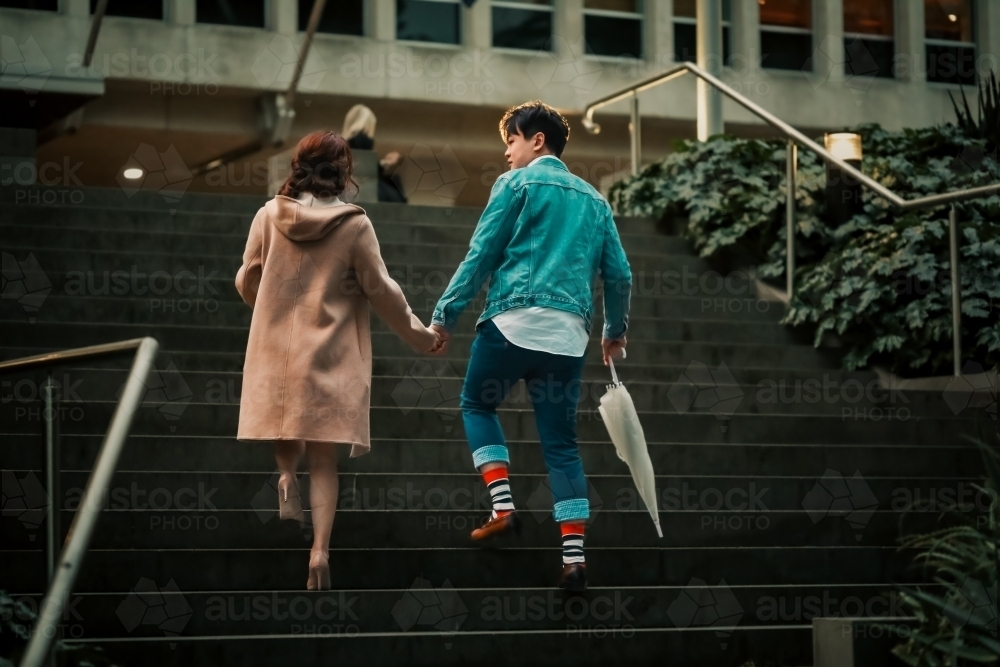 Image of Couple walking together up stairs at Treasury Gardens in ...