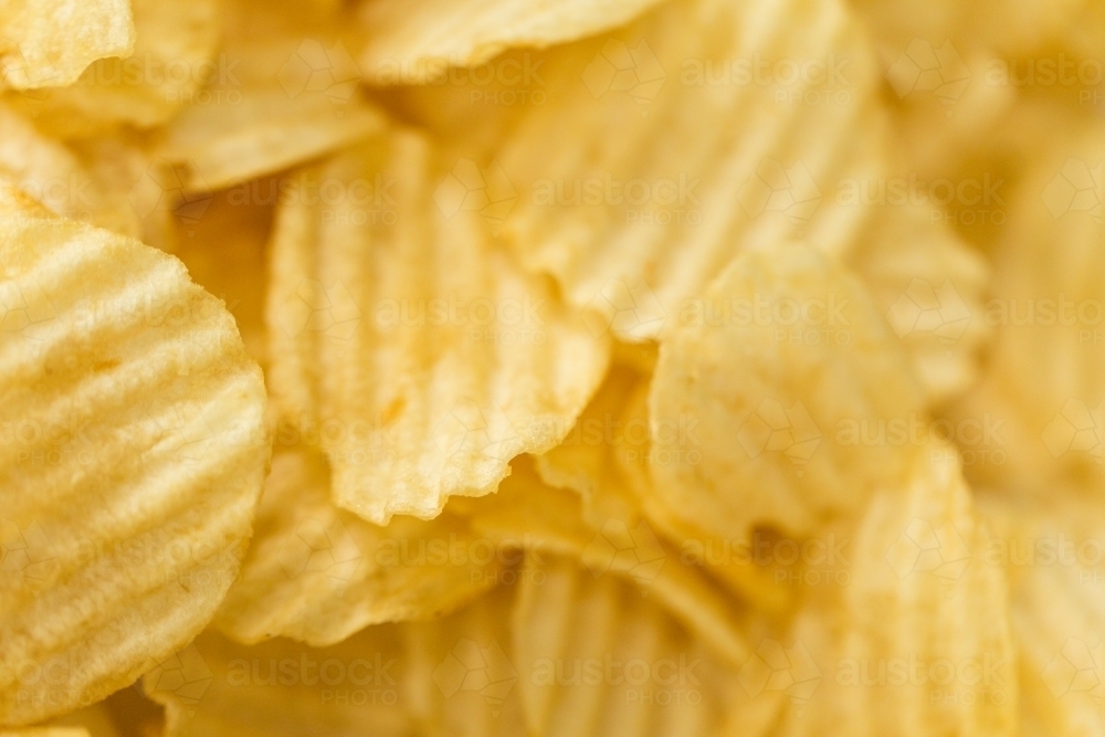 Image of Crinkle cut potato crisps - Austockphoto