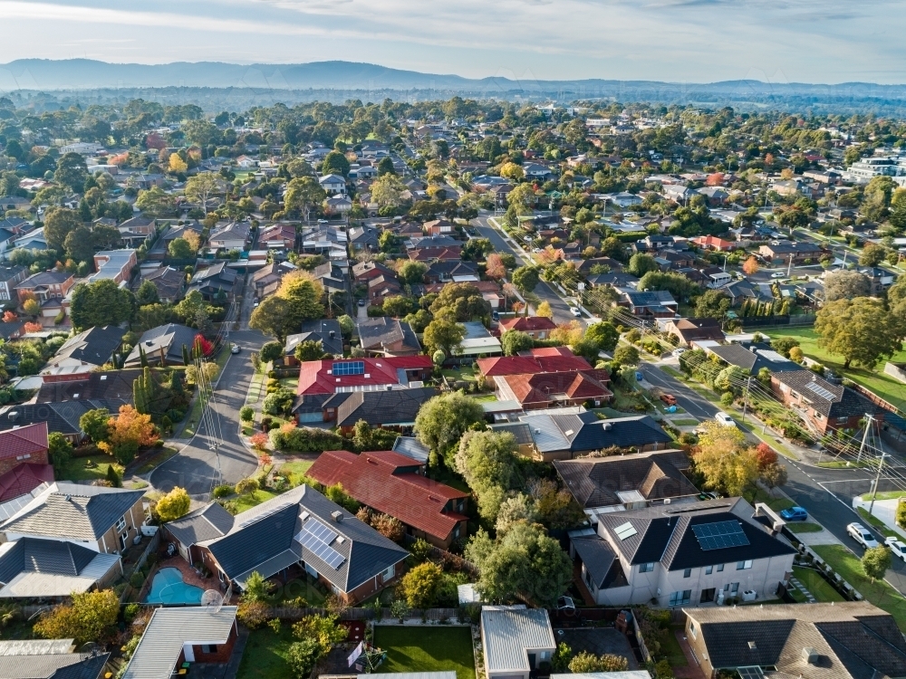 Image of cul-de-sac and colourful city suburb houses in morning light ...