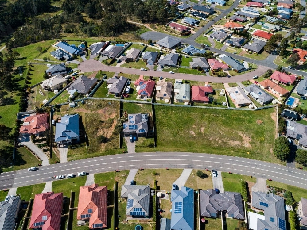 Image of Cul de sac street with houses and empty blocks in well to do ...