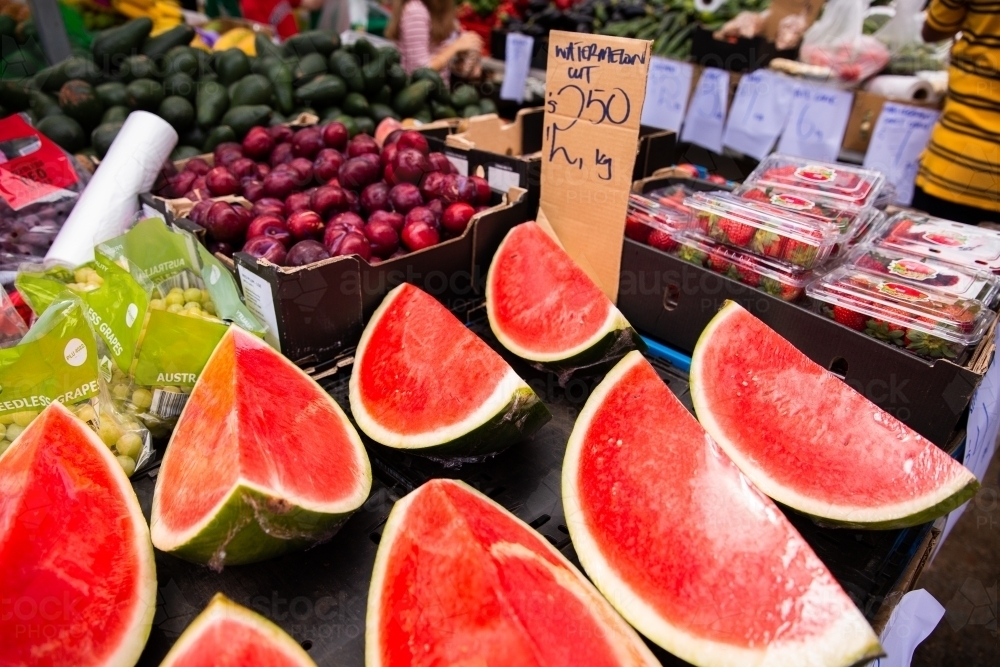 Image of cut watermelon for sale at farmers markets - Austockphoto