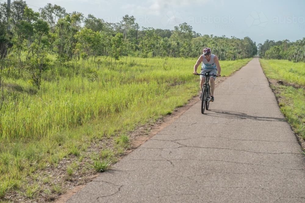 Image of Cyclist on bush bike path - Austockphoto