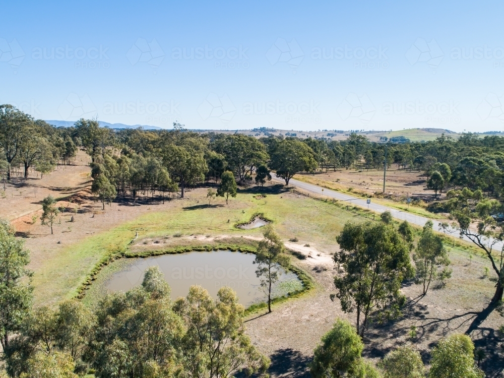 Image of Dam in dry paddock - Austockphoto