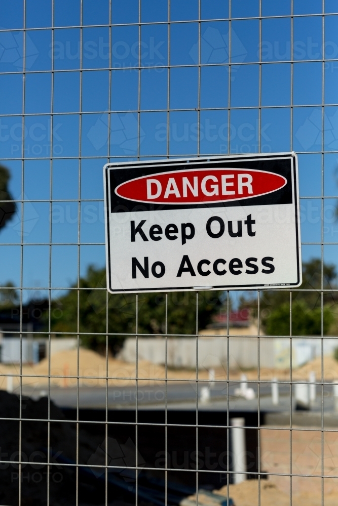 Image of Danger, keep out sign on building site - Austockphoto