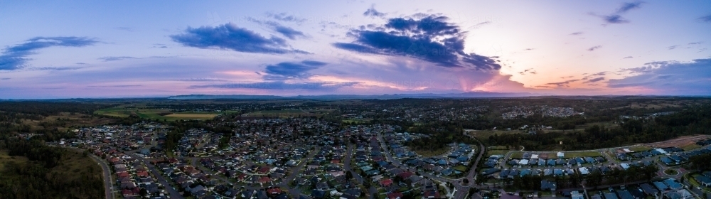 Image of Deep purple sunset sky over houses of Singleton in NSW ...