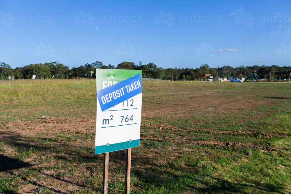 Image of Deposit taken on for sale sign on empty lot in new housing ...