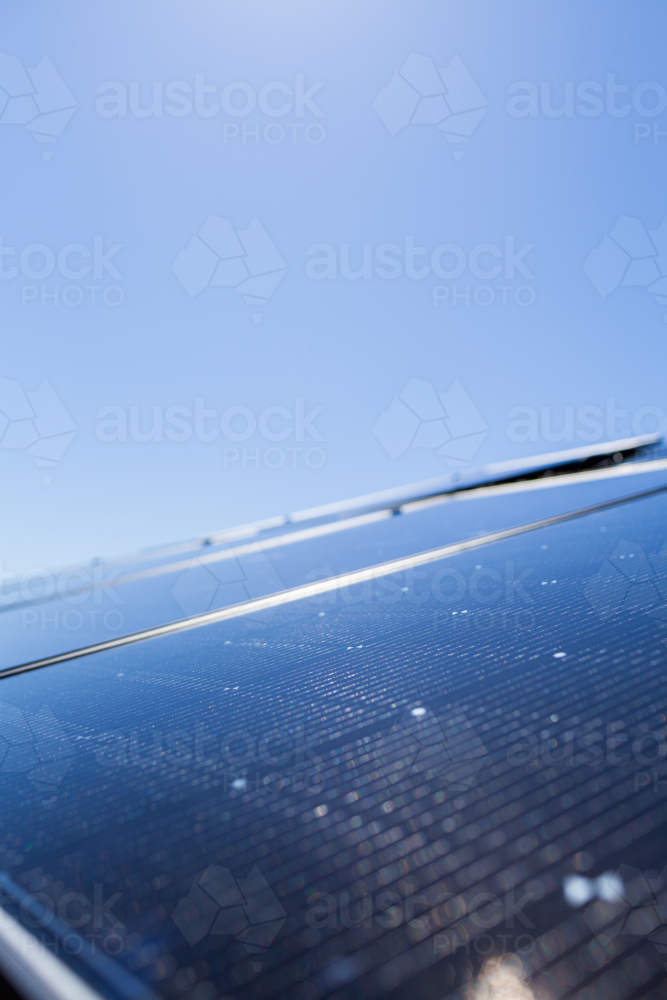 Image of Detail of all Black bifacial solar panels on roof ready to be ...