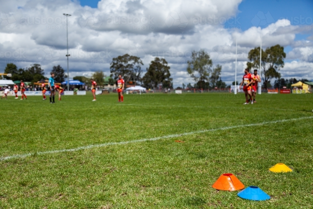 Image of Detail of colourful cones on sporting field - Austockphoto