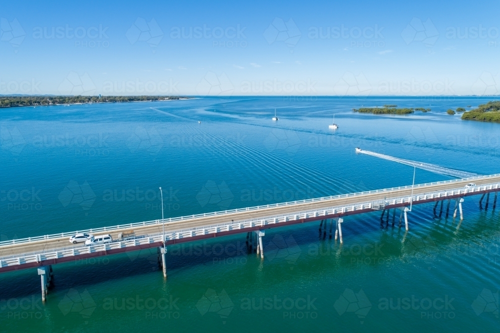 Image of Diagonal aerial view of bridge and estuary. - Austockphoto