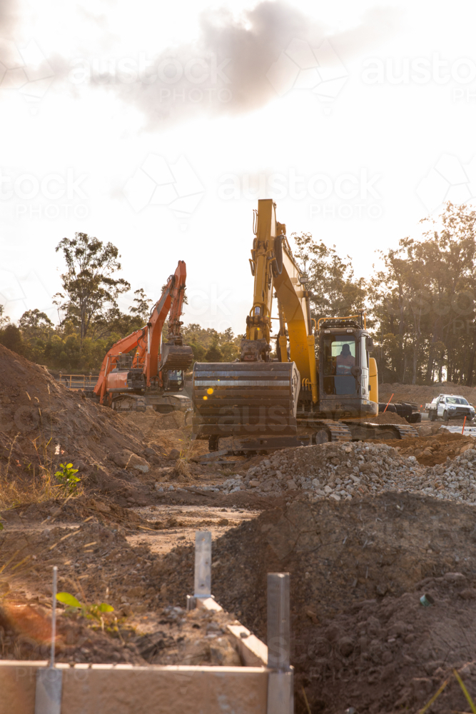 Image of diggers getting land ready for housing in a new development ...