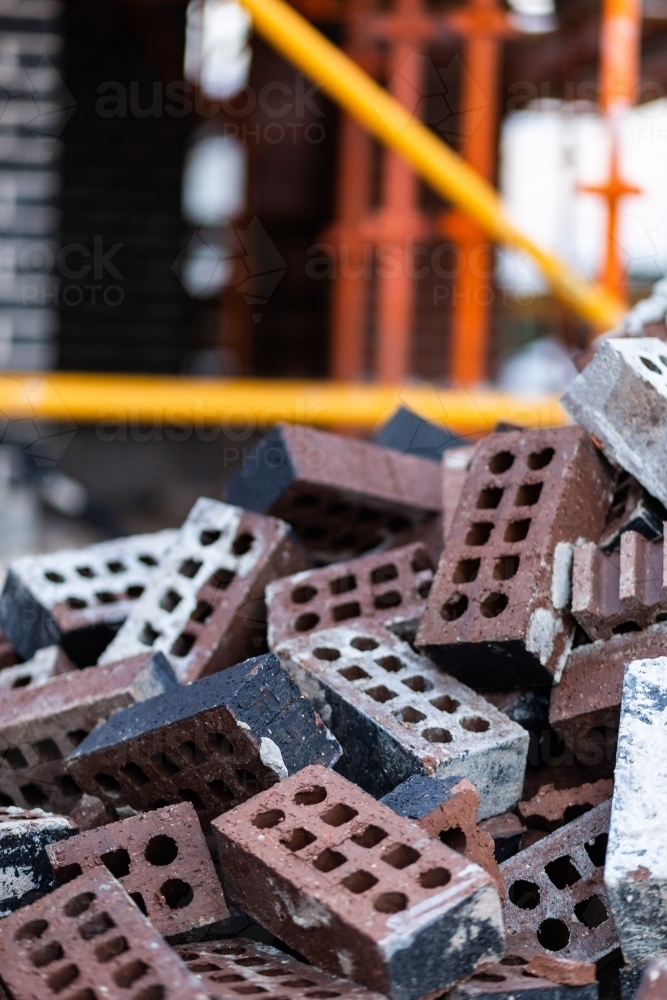 Image of Discarded bricks in pile on construction site - Austockphoto