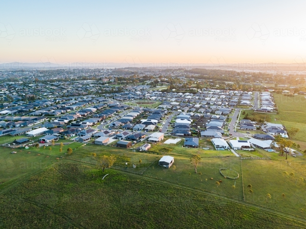 Image of Drone image of last light of the day over suburb of ...