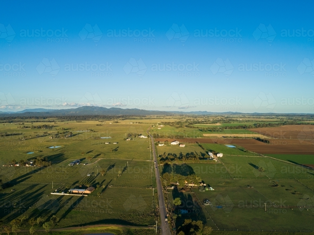 Image of Drone view of agricultural landscape with green paddocks in ...