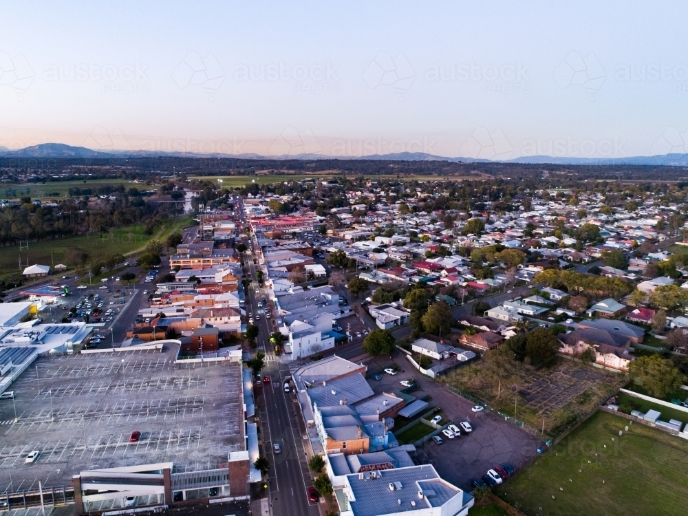 Image of Drone view of almost empty carpark and main street in country ...
