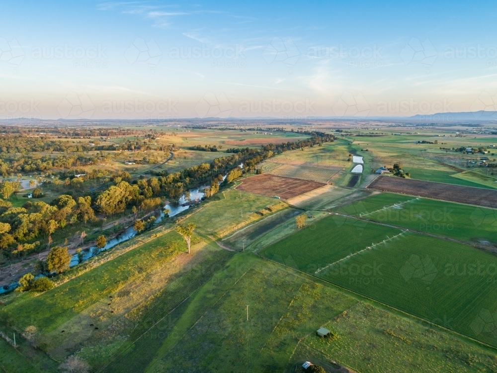 Image of Drone view of lush green farm paddock with irrigation system ...
