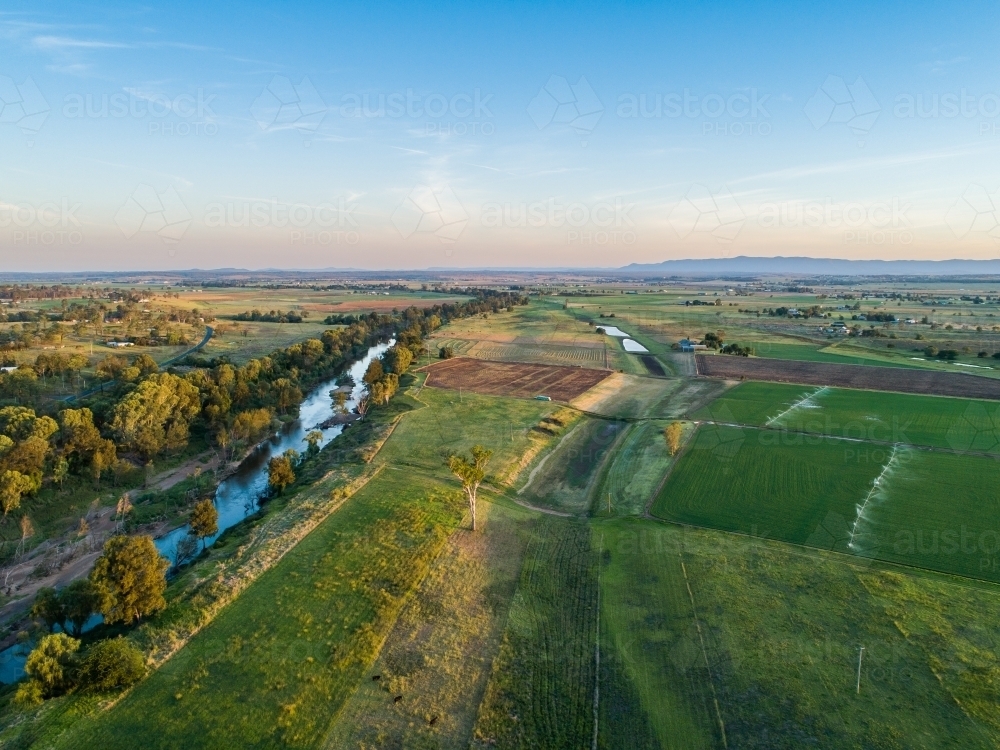 Image of Drone view of lush green farm paddock with irrigation system ...
