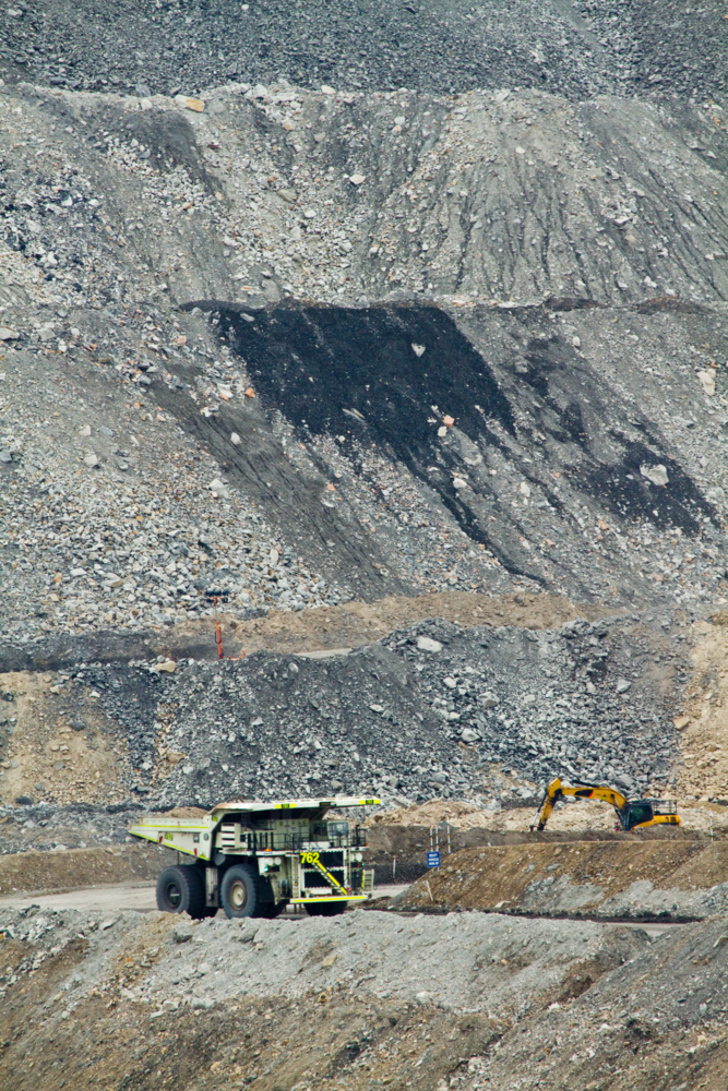 Image of Dump truck and excavator in open cut coal mine near Singleton ...