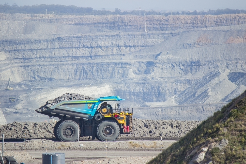 Image of Dump truck carting coal through open cut mine in the hunter ...