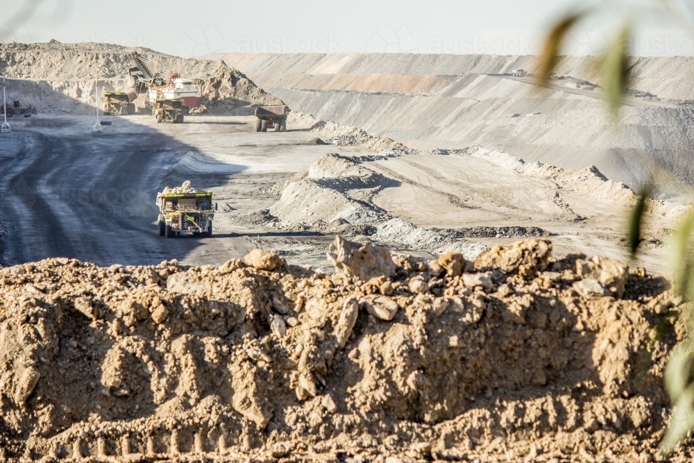 Image of Dump trucks filling up with overburden and carting it through ...