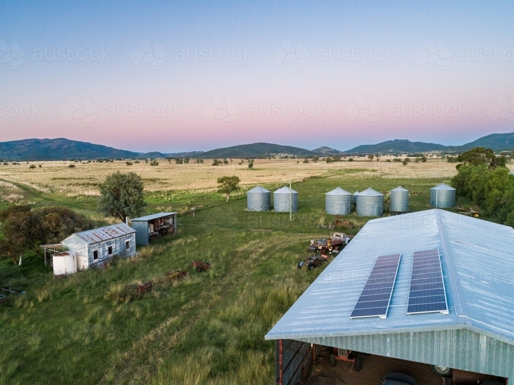 Image of Dusk light on solar-powered farm shed harnessing renewable ...