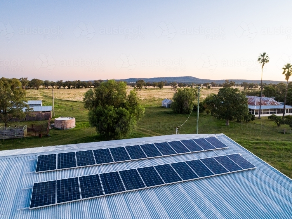 Image of Dusk light on solar-powered farm shed harnessing renewable ...