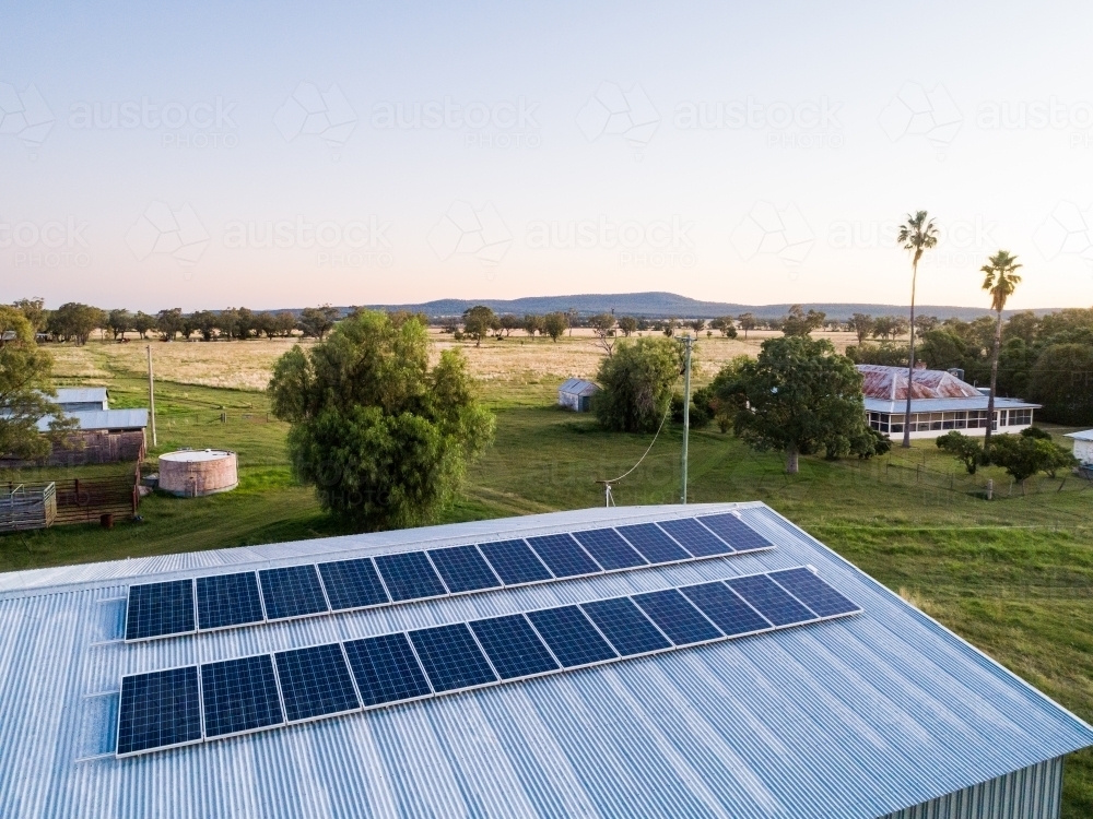 Image of Dusk light on solar-powered farm shed harnessing renewable ...