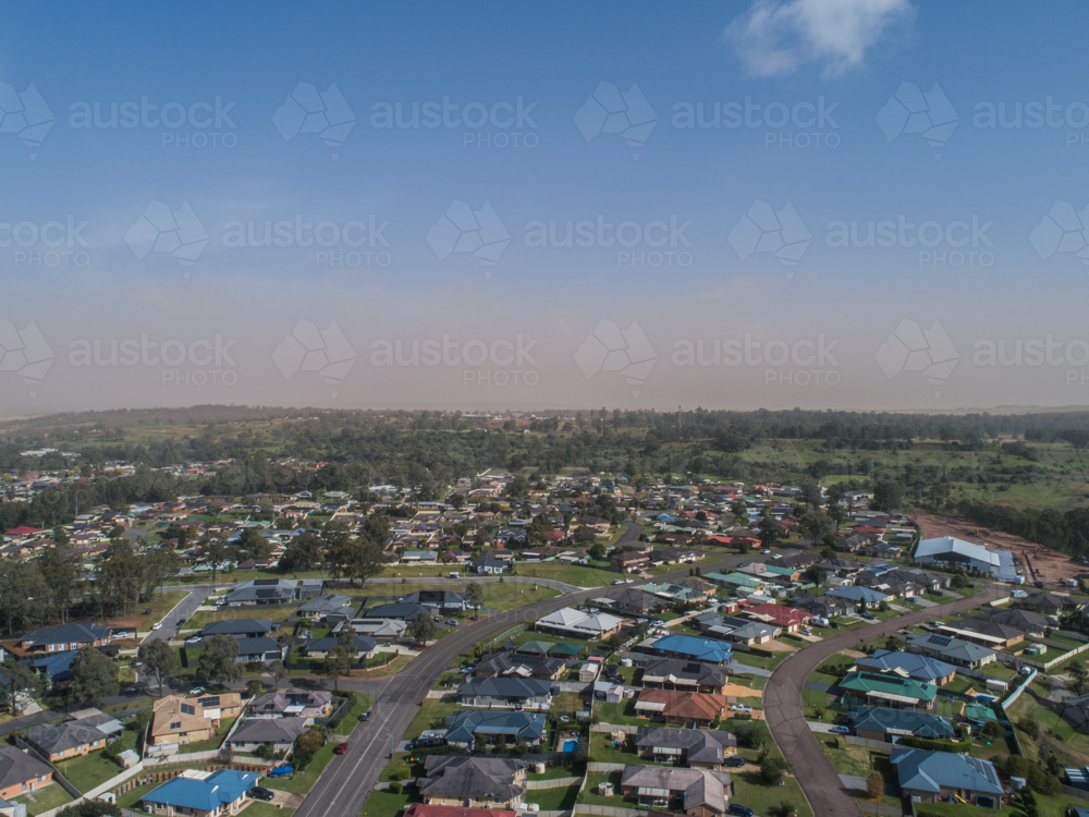 Image of Dust storm haze on horizon over rooves of Australian town in ...