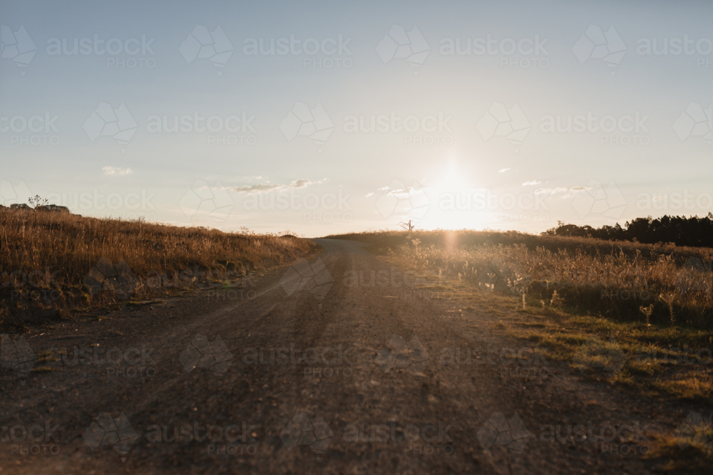 Image of Dusty country road in rural Australia at sunset - Austockphoto