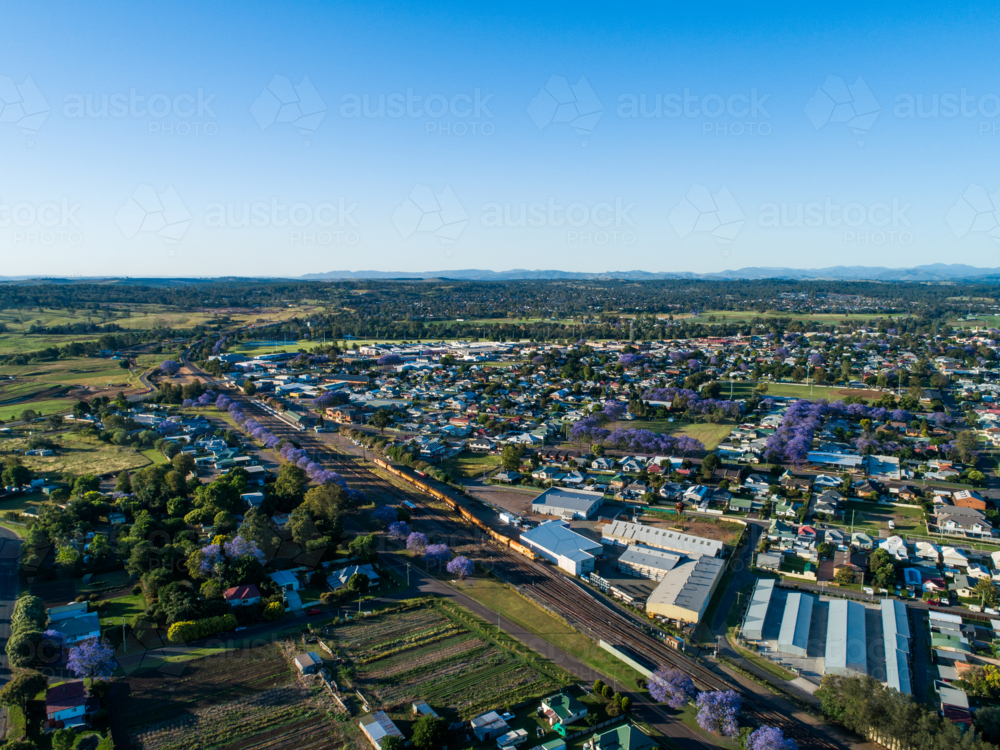 Image of Edge of country town in Australia in early summer with purple ...