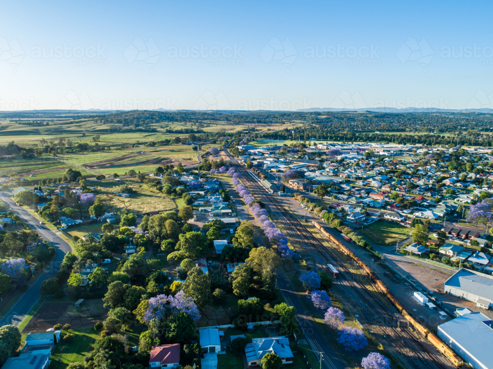 Image of Edge of country town in Australia in early summer with purple ...