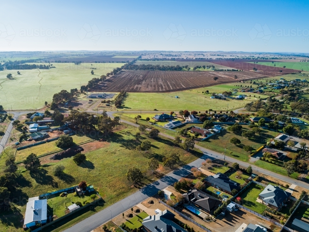 Image of Edge of country town to ploughed farmland - Austockphoto