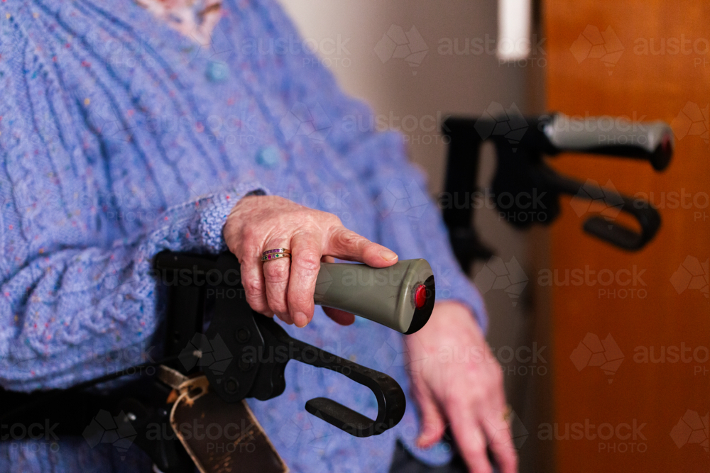 Image of elderly Australian woman with walker mobility aid in bedroom ...