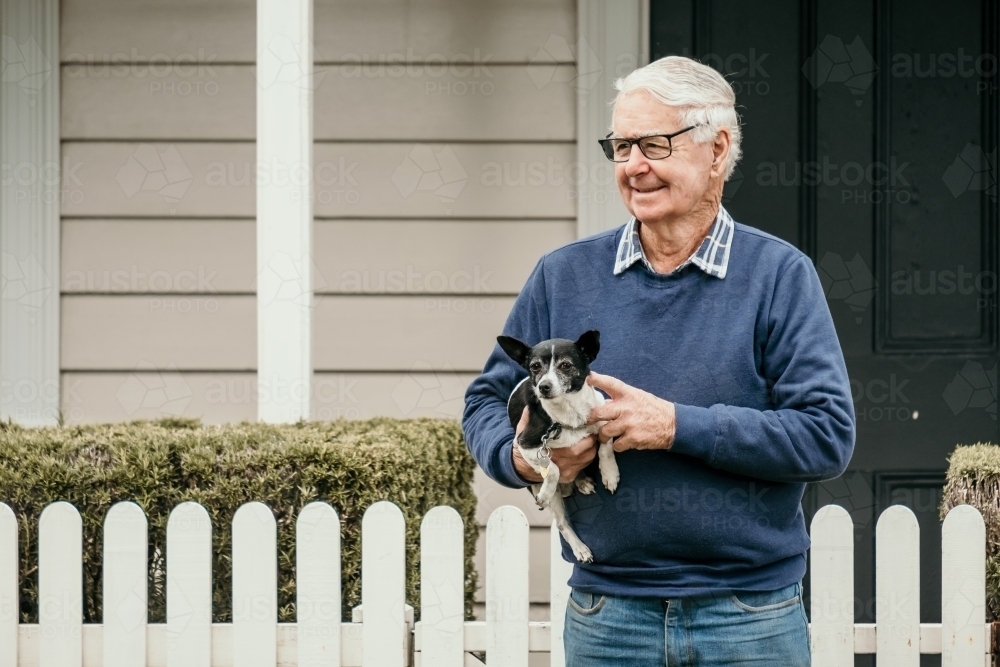 Image of Elderly man with his dog - Austockphoto